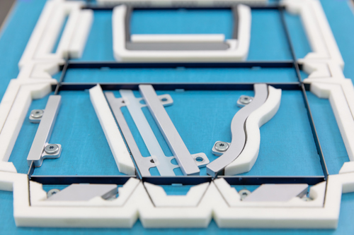 Split height-adjustable anvil for reduced make-ready times during ...