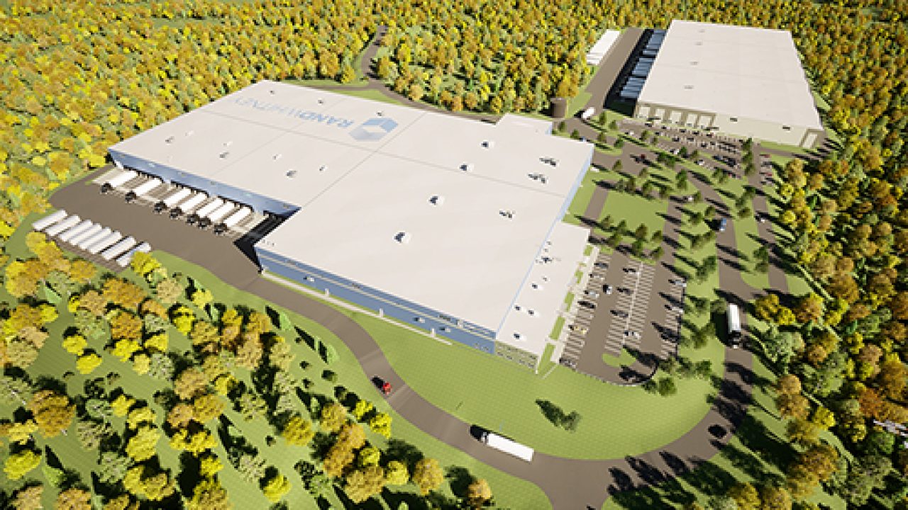 Rand-Whitney signs and raises final beam on its latest facility ...